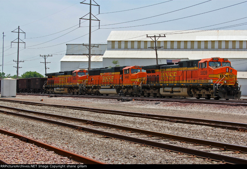 BNSF 5839 and others sit tied down on a ore train.